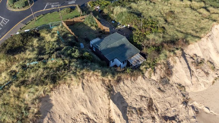Horror photo of house hanging on edge of cliff about to crash into the ...