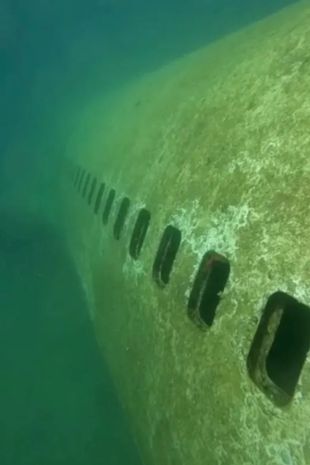 Footage shows inside of sunken passenger plane once mistaken for ...