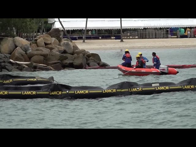 Floating oil containment booms deployed at Sentosa | Nestia