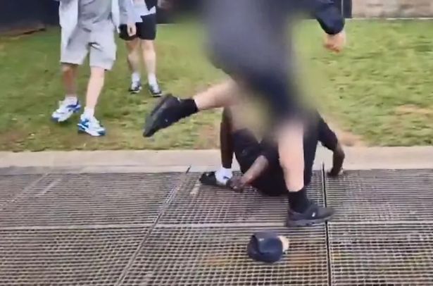 Black man kicked and punched by mob throwing fences in shocking riot ...