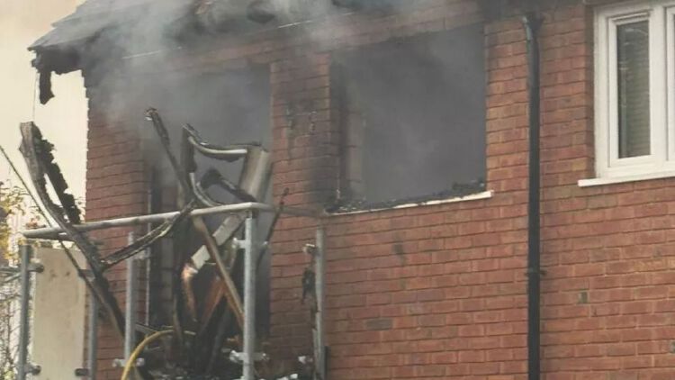 Catford house fire sparks huge inferno as woman scrambles to roof to ...