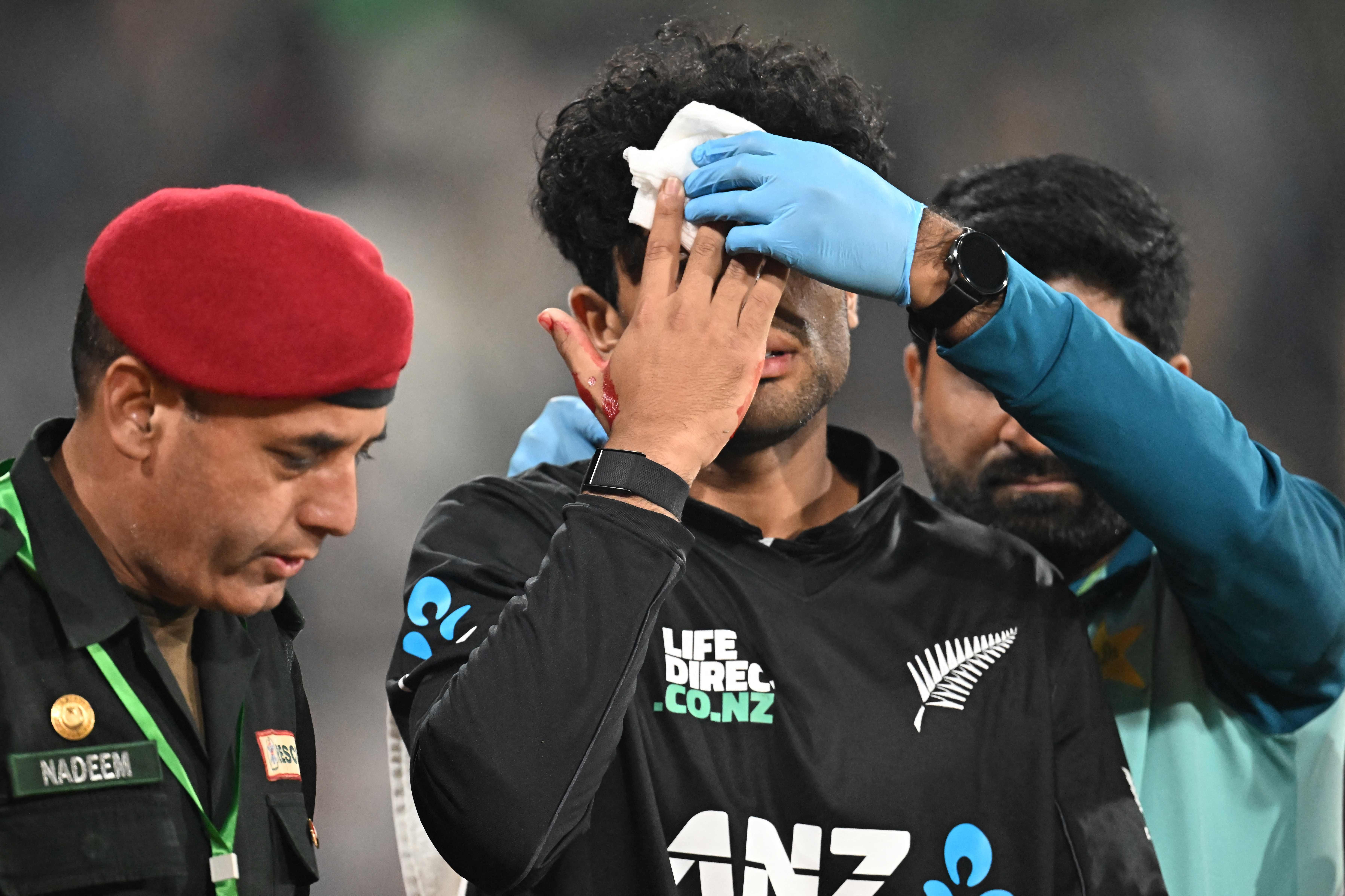 New Zealand’s Rachin Ravindra bloodied by ball to the face in Lahore cricket match against ...