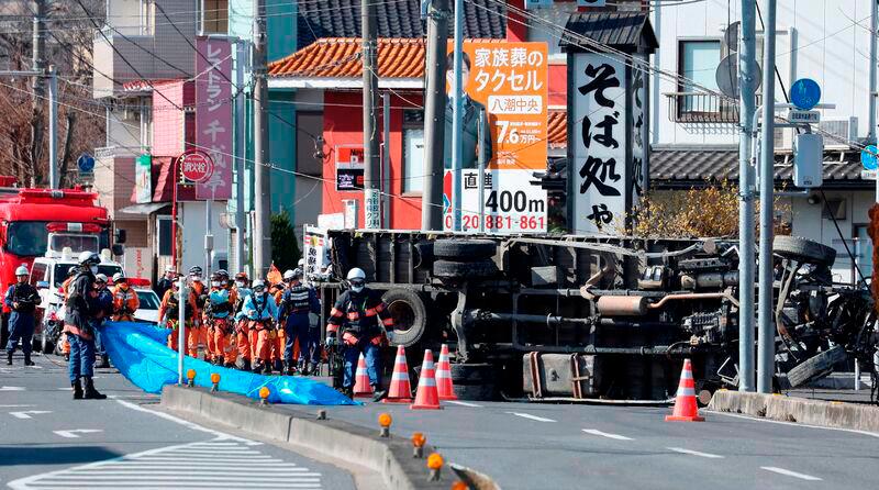 Truck driver’s body recovered from huge Japan sinkhole after three ...