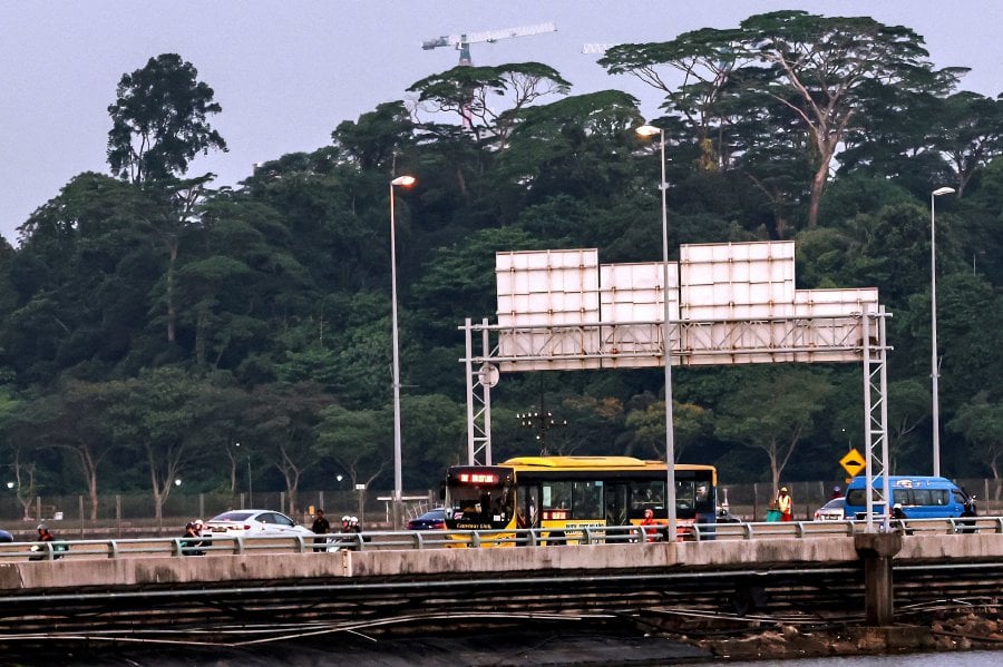 Pay cut, extra trips caused strike among Singapore-bound bus drivers ...